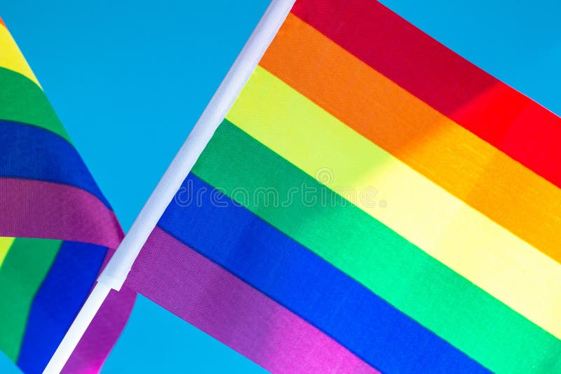 Rainbow Flag Flapping in the Wind, Gay Pride or LGBT Flag on Blue Sky ...