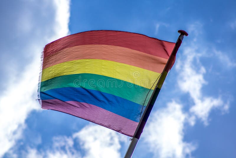 Rainbow Flag Flying in Breeze Stock Photo - Image of lesbian, love ...