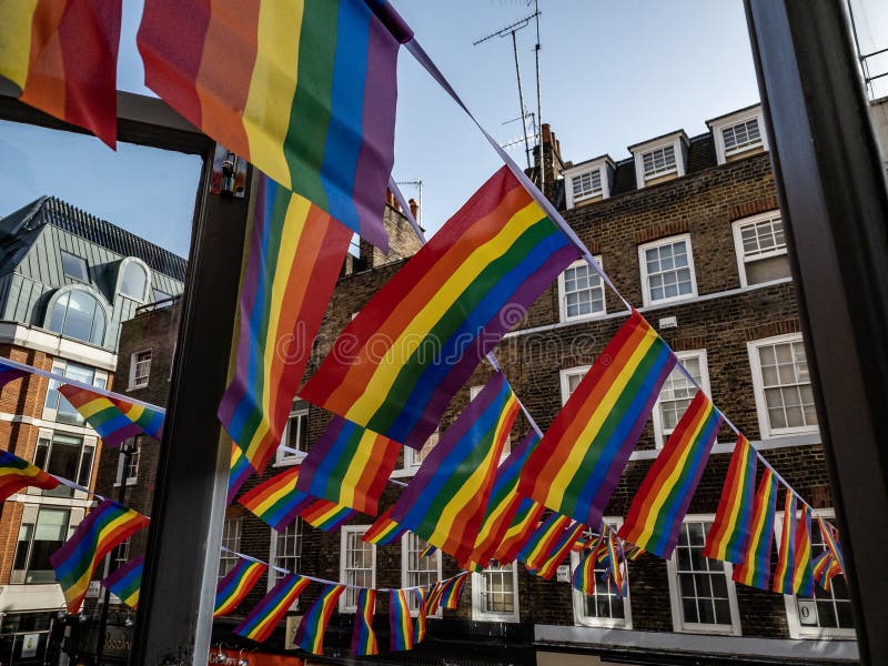 Rainbow flags on a street editorial stock image. Image of equality ...