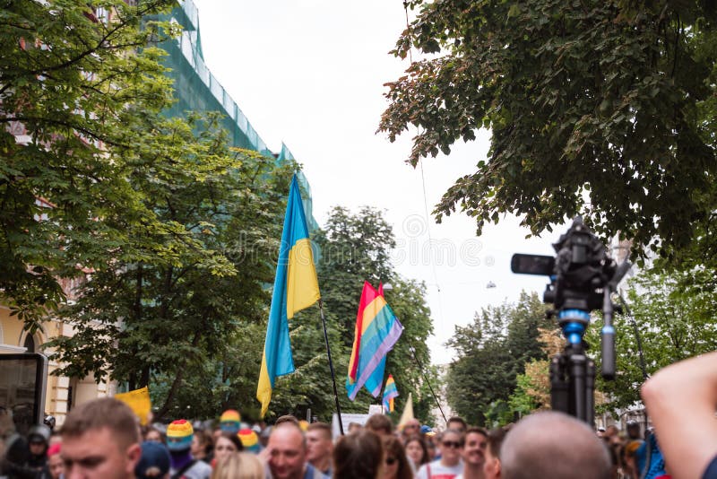 Rainbow Flags Waving Over the Crowd during the Pride Parade Stock Image ...