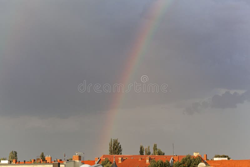 Rainbow with a grey sky stock image. Image of light - 124339987