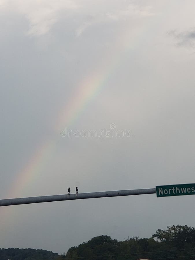 Rainbow at Intersection while Driving on a Cloudy Day Stock Image ...