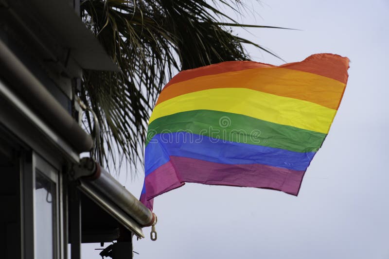 Rainbow LGBT Flag Waving at Bar Entrance Outdoors Stock Image - Image ...