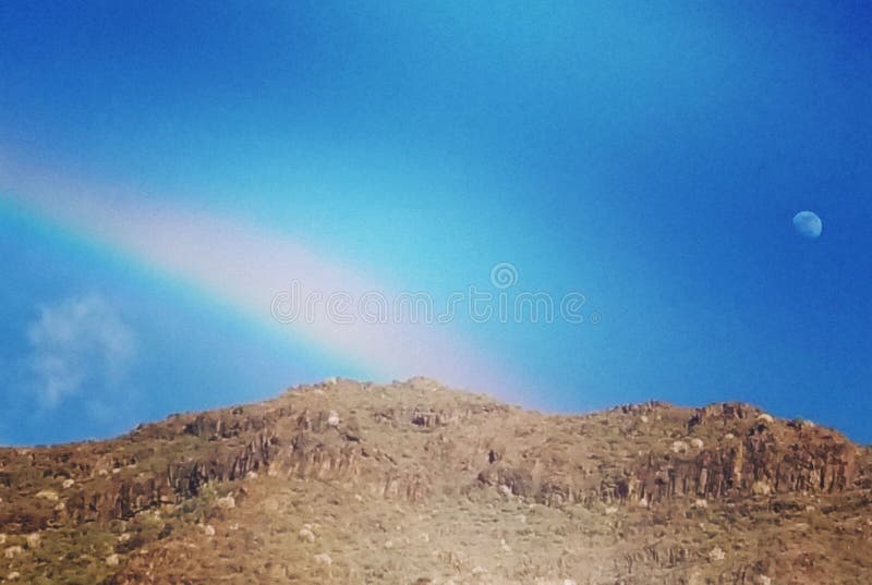 Rainbow and moon stock photo. Image of nature, mountain - 146331460