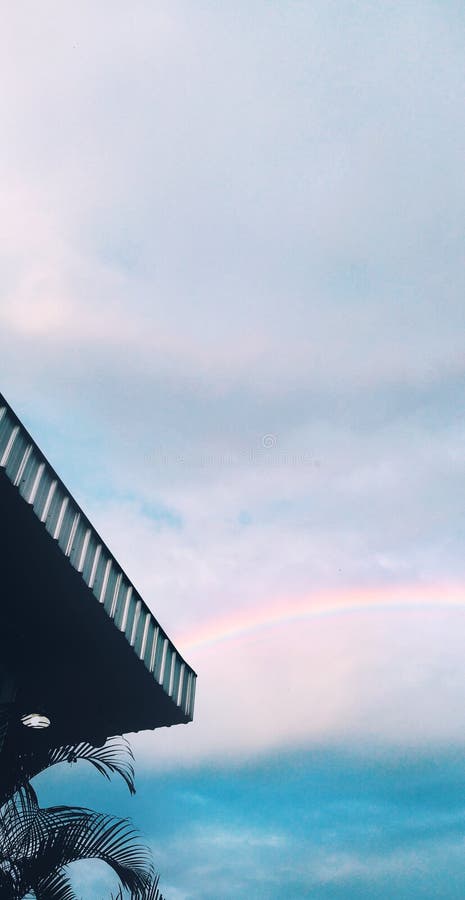 Rainbow in the Morning View and Building with Palm Tree Stock Image ...
