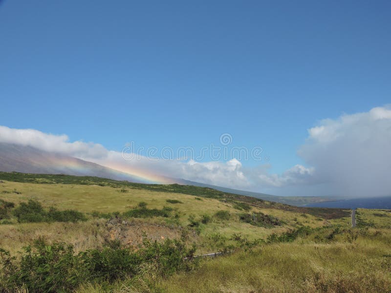 Rainbow on the mountain stock photo. Image of rain, lava - 63982556