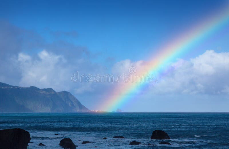 Rainbow on the ocean stock photo. Image of horizons - 170497148