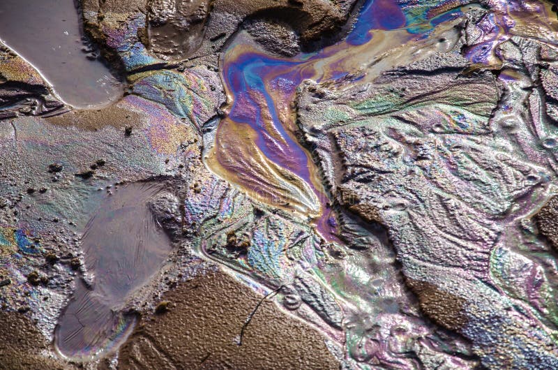 Rainbow Oil Slick on a Road Stock Photo - Image of petroleum ...
