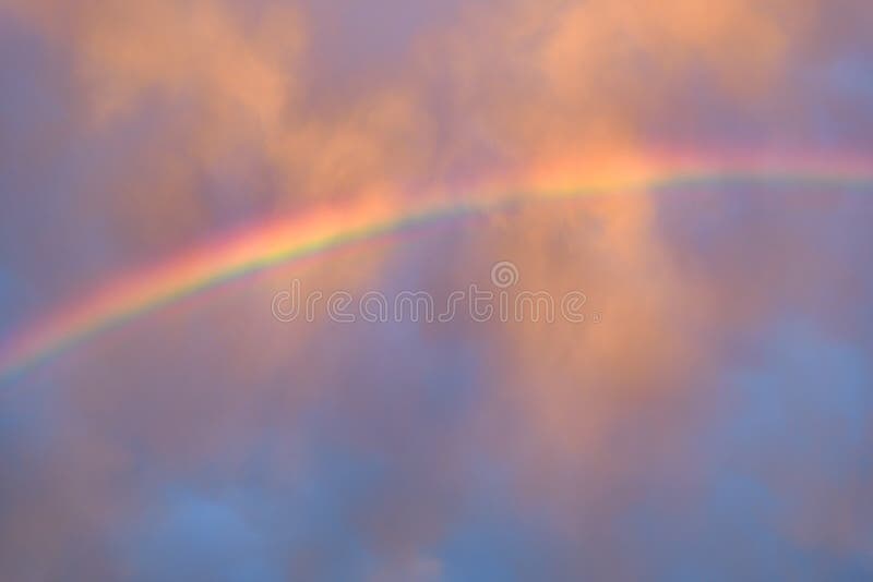 Rainbow in an Orange Sky at Sunset. Stock Photo - Image of background ...