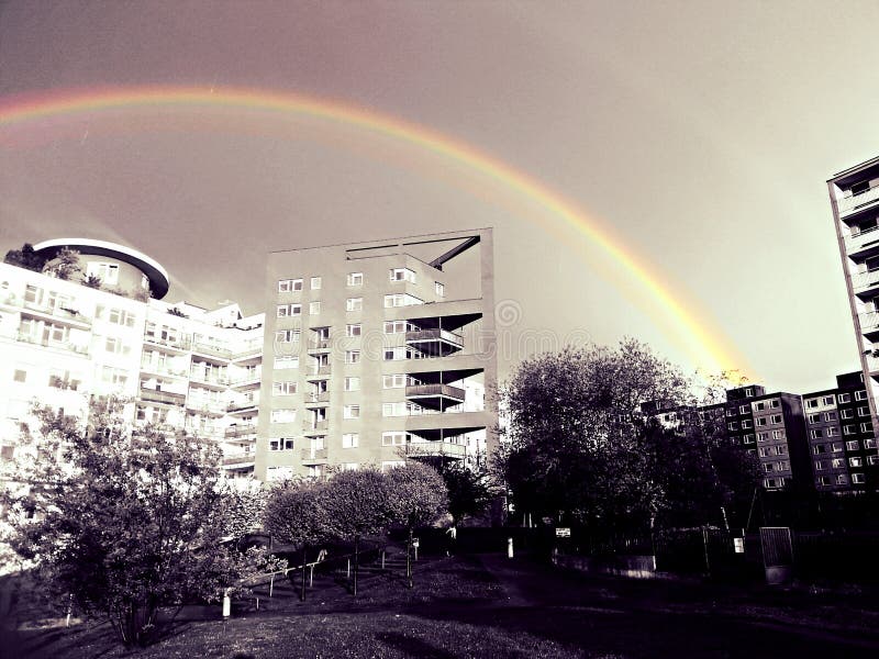 Rainbow over buildings stock image. Image of muted, buildings - 47576695