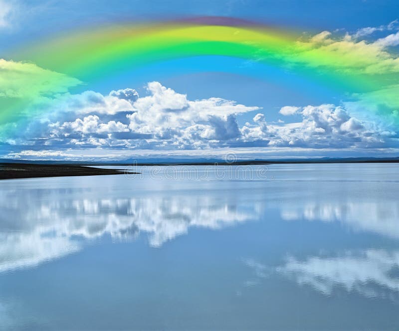 Rainbow over calm lake stock photo. Image of imagination - 85297636