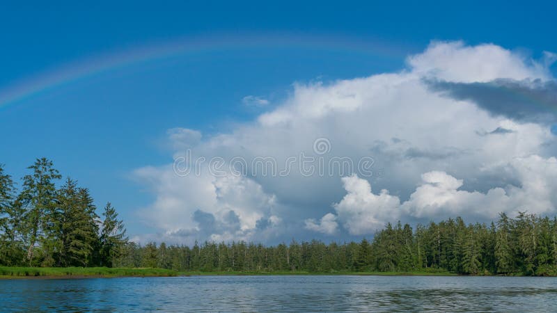 Rainbow Over Chehalis River from Kayak Stock Photo - Image of clouds ...