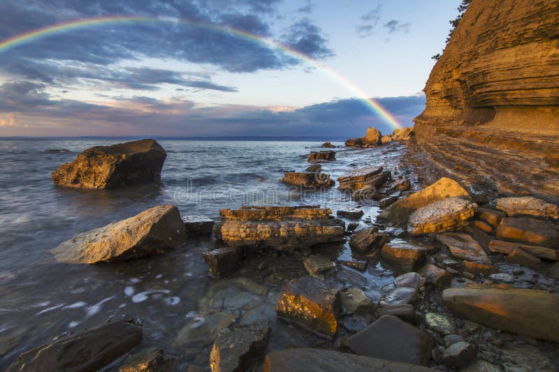 Rainbow Over the Cliff after Passing an Evening Storm Stock Photo ...