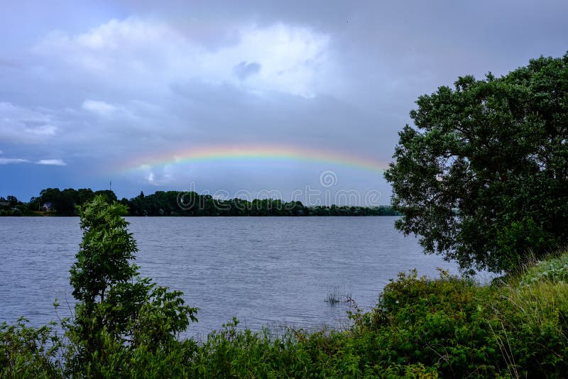 Rainbow in the country stock photo. Image of rainbow - 145953882