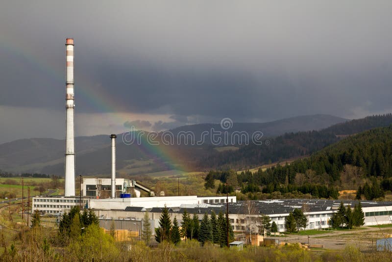 Rainbow over a factory stock photo. Image of smokestack - 24844166