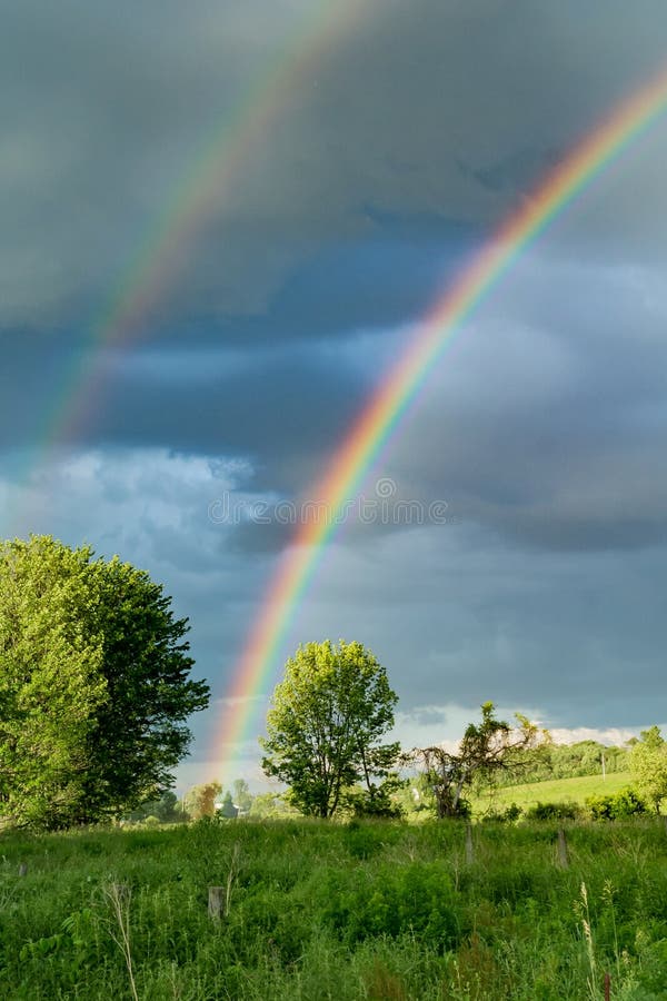 Rainbow over a farm stock photo. Image of grass, outdoors - 20024016