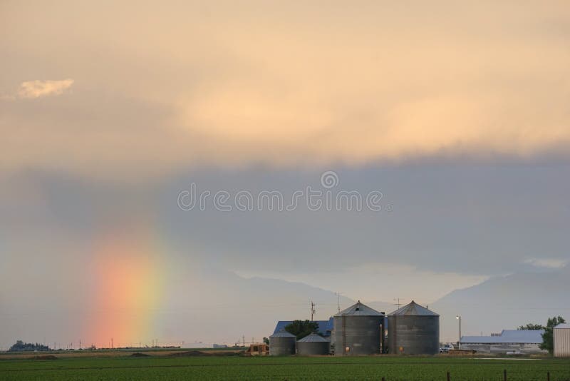 Rainbow over a farm stock image. Image of background - 242656571