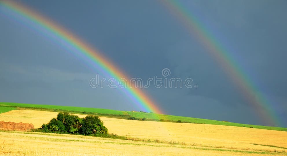 Rainbow over the field stock photo. Image of light, meteorology - 15745000