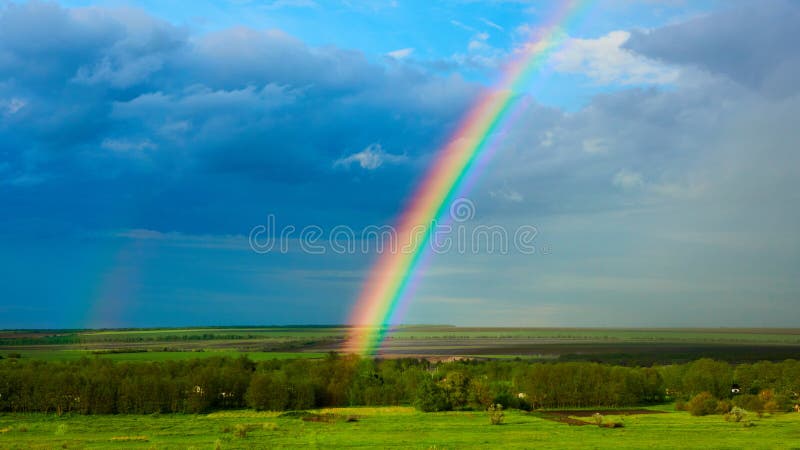 The Rainbow Over a Field after Thunderstorm Stock Image - Image of rain ...