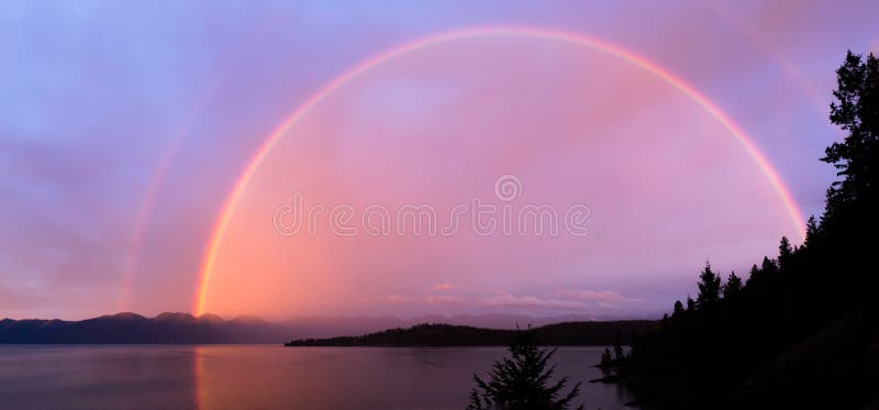 Rainbow over Flathead Lake stock photo. Image of pink - 44639830