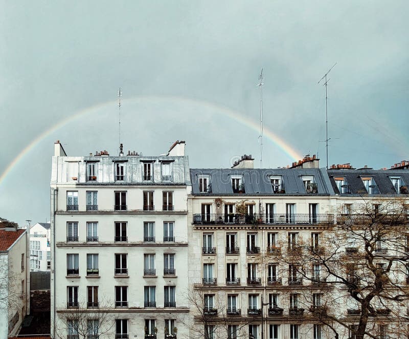 The Rainbow Over the Haussmanian Building in the City of Paris Stock ...