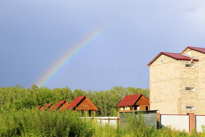Rainbow over the houses. stock image. Image of house - 39357245