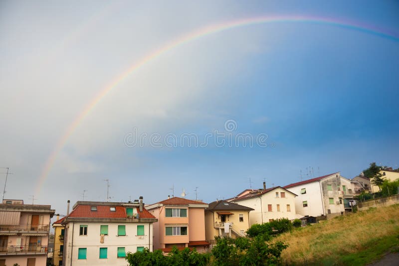 Rainbow Over Houses of a Small Town Stock Photo - Image of town, houses ...