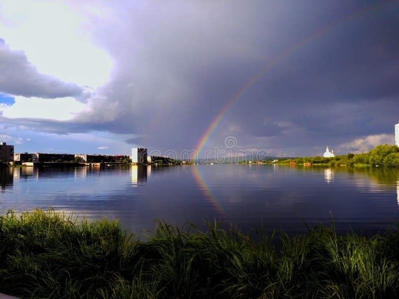 Rainbow over the lake editorial image. Image of reflection - 252032565