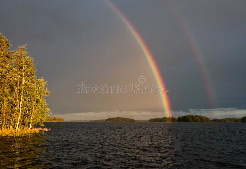 Rainbow from the Deck, Lake of the Woods, Kenora, Ontario Stock Photo ...
