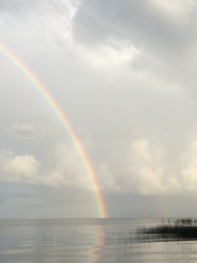 Rainbow Over Lake with Clouds Stock Image - Image of outdoors ...