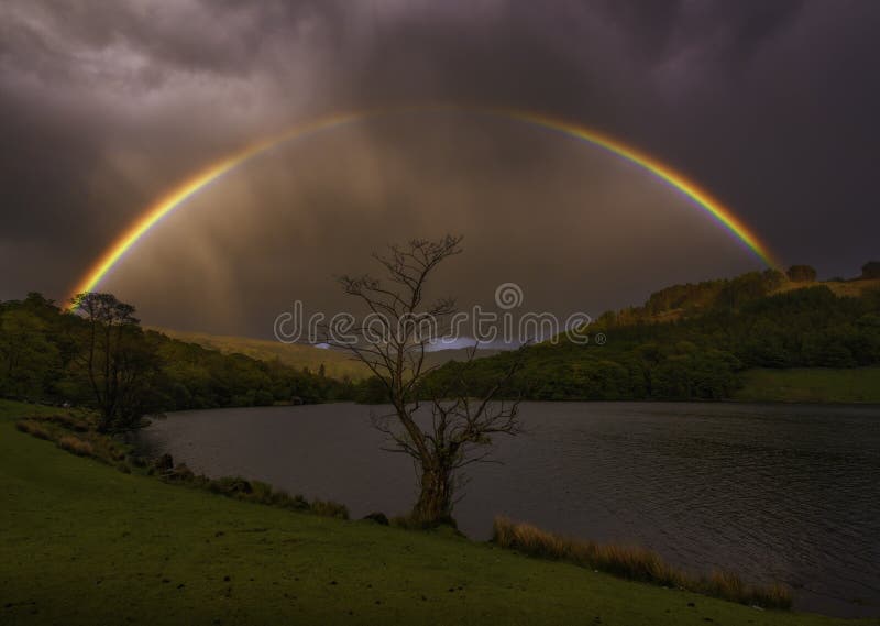 Rainbow over the Lake stock image. Image of shore, sunset - 54902135