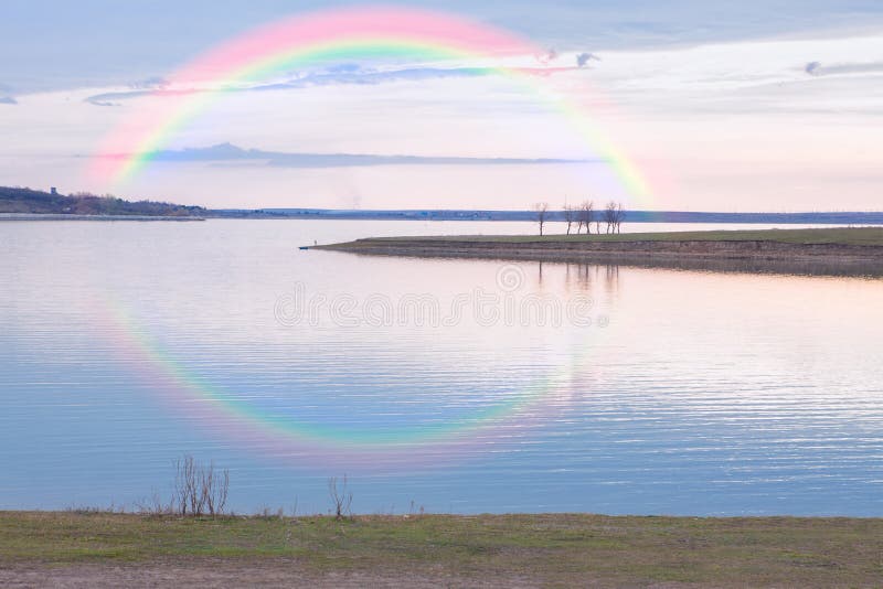 Rainbow over lake stock image. Image of mirror, phenomenon - 95817925