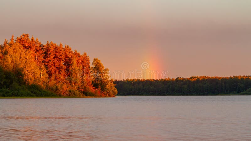 Rainbow Over the Lake at Sunset Stock Image - Image of idyllic, light ...