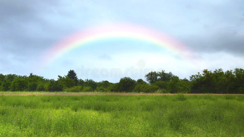 Rainbow over the meadow stock image. Image of green, outdoor - 64453469