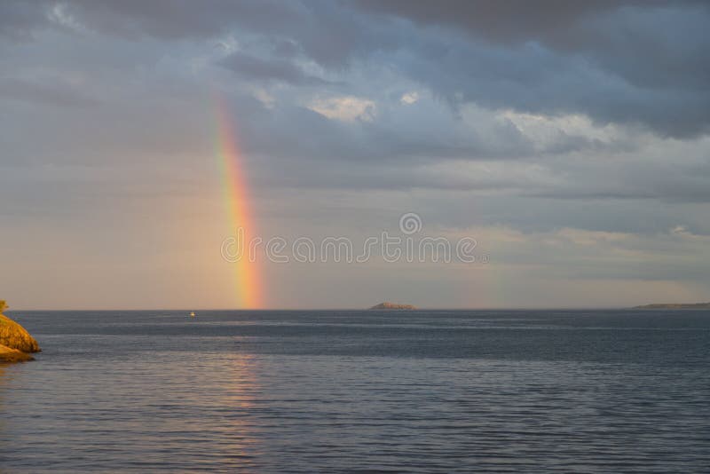 Rainbow Over Ocean at Sunset Stock Image - Image of coast, island ...