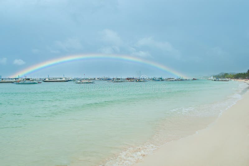 Rainbow over the pier stock image. Image of harbour, cloudy - 74581483