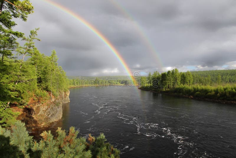 Rainbow over the river stock photo. Image of forest, trees - 32508592