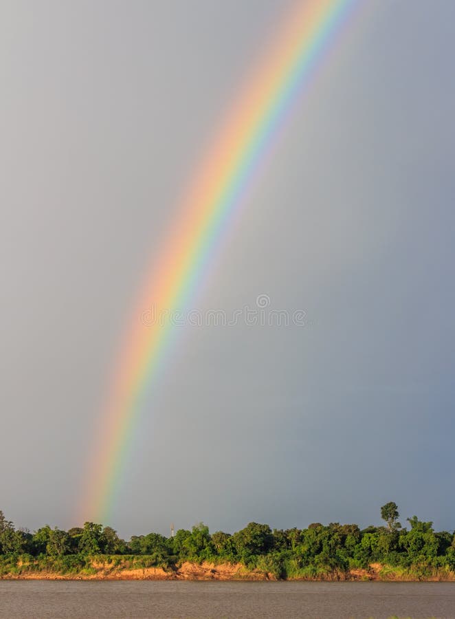 Rainbow over river stock photo. Image of cloudy, agriculture - 62032436