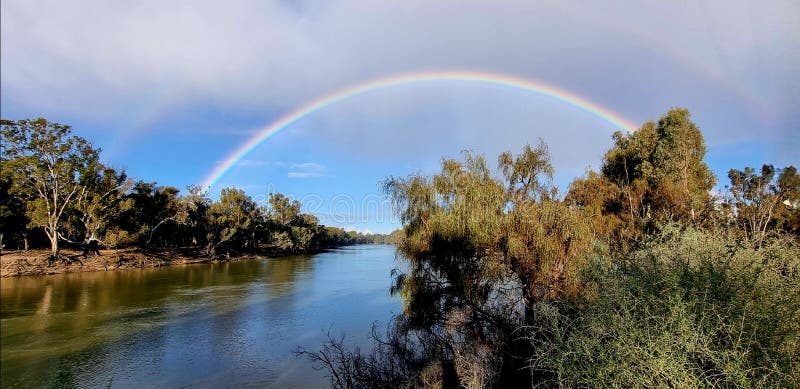 Rainbow over River stock image. Image of stunning, river - 326575103