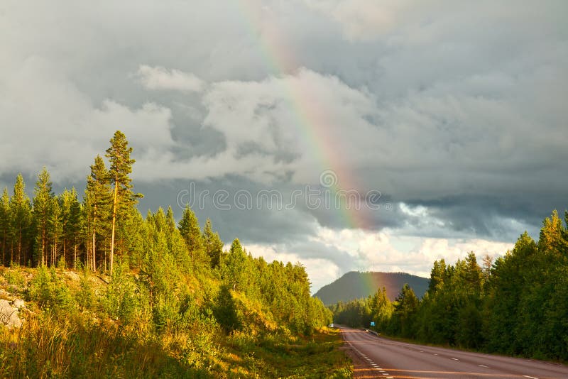 Rainbow over road stock image. Image of solar, highway - 23900317