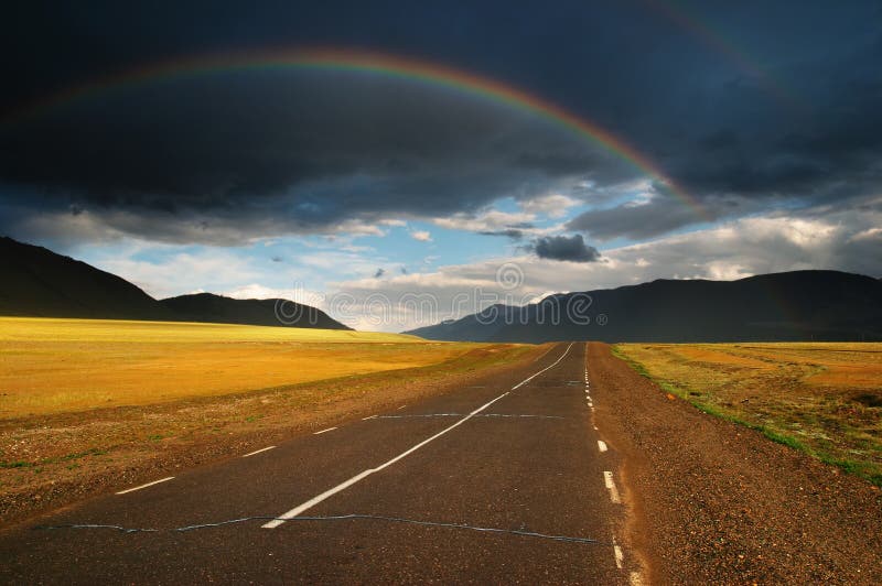 Rainbow over road stock photo. Image of dusk, rainbow - 2970584