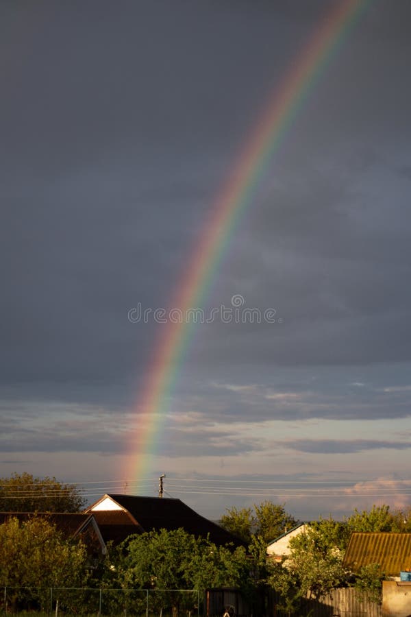 Rainbow Over a Roofed House in the Clouds Stock Image - Image of skye ...