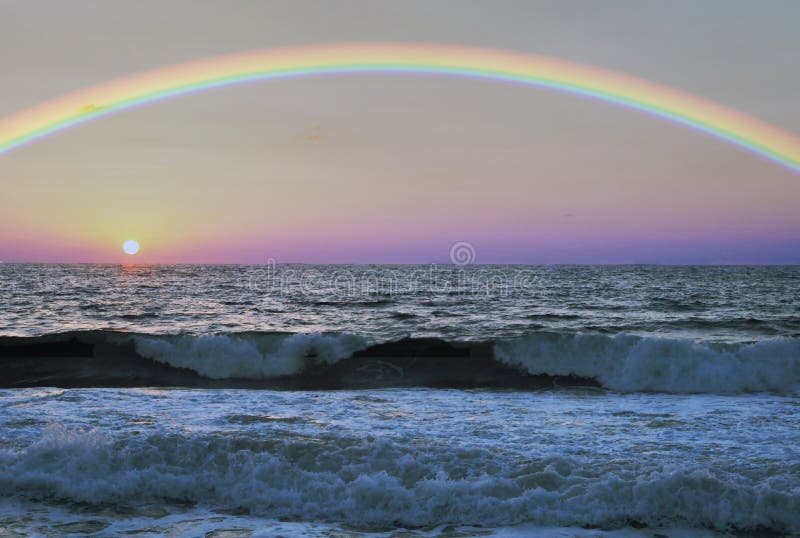 Rainbow over the sea stock photo. Image of water, blue - 272174