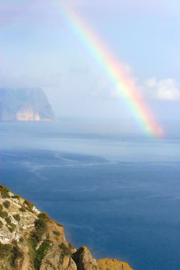 Rainbow over sea stock photo. Image of force, storm, hill - 5175966