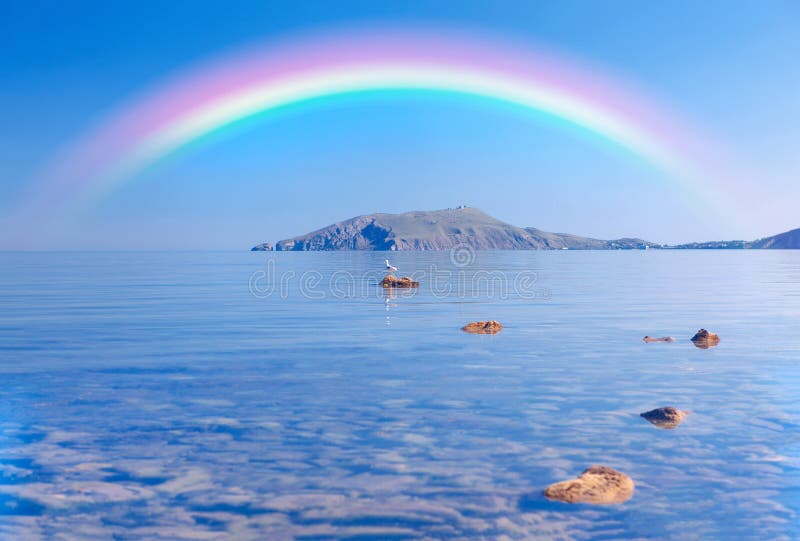 Rainbow over the sea stock photo. Image of tourism, light - 89960746