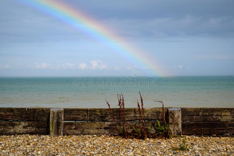 Rainbow Over the Sea Behind a Pebble Beach in Dover Stock Photo - Image ...