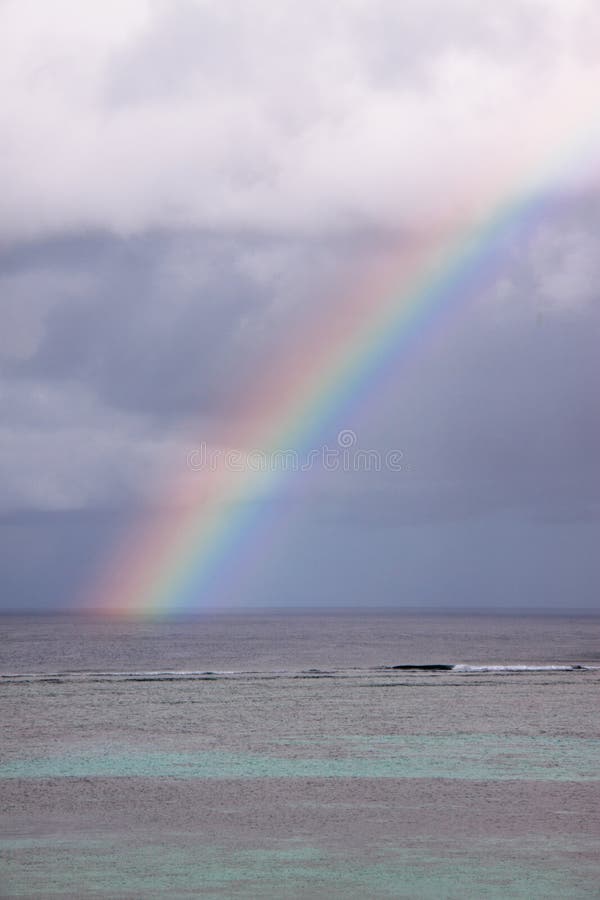 Rainbow over the sea. stock photo. Image of natural, phenomenon - 89676716