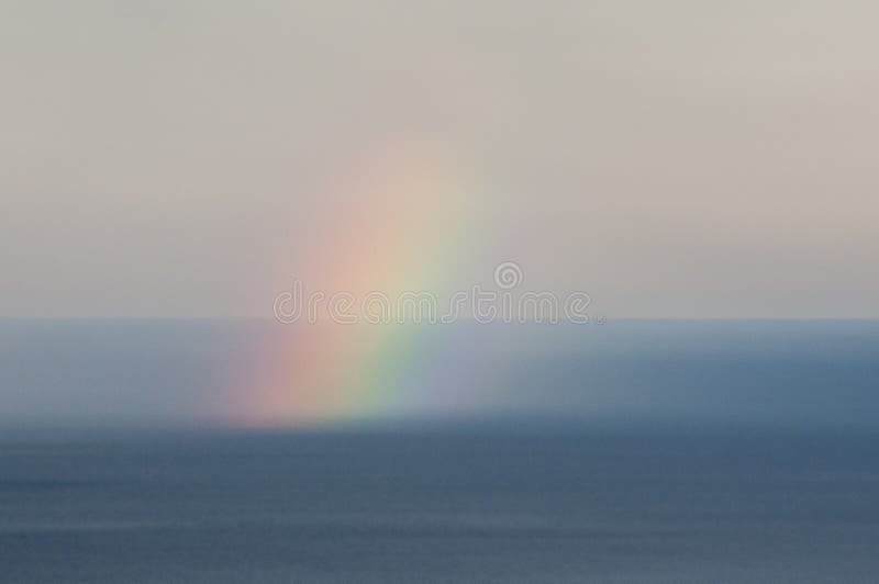 Rainbow over sea water stock image. Image of wharf, towering - 47751675