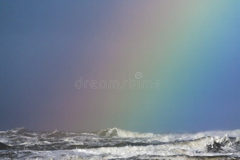 Rainbow over sea stock photo. Image of grafisch, netherlands - 129048020
