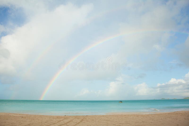 Rainbow Over Tropical Beach Stock Photo - Image of sand, sunny: 51891440